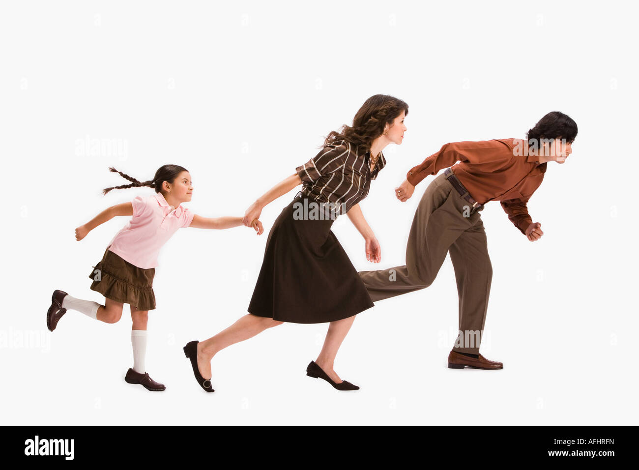 Studio portrait of family running Stock Photo - Alamy