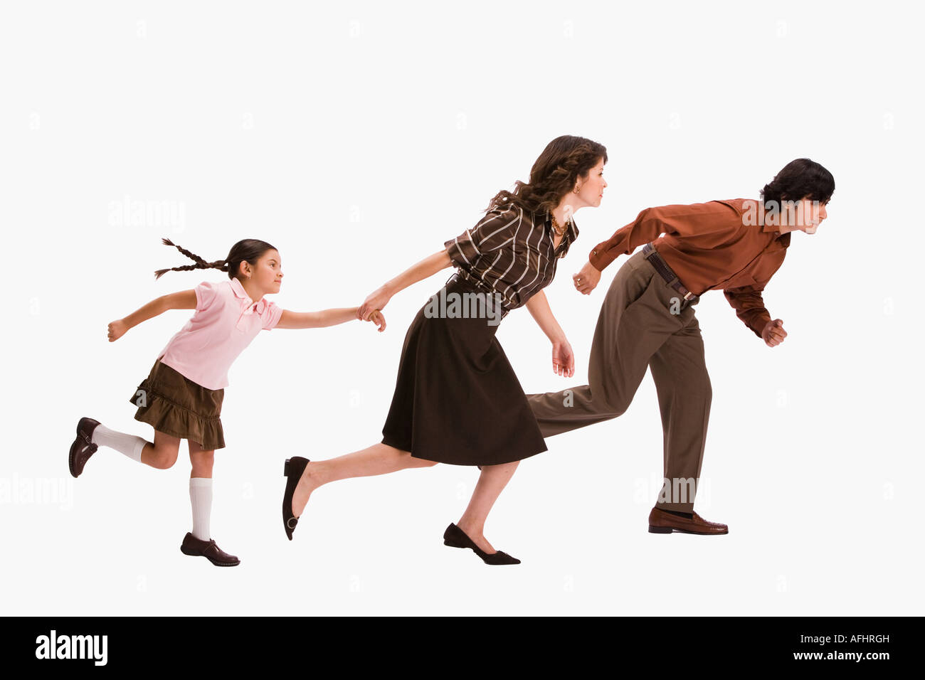 Studio portrait of family running Stock Photo - Alamy