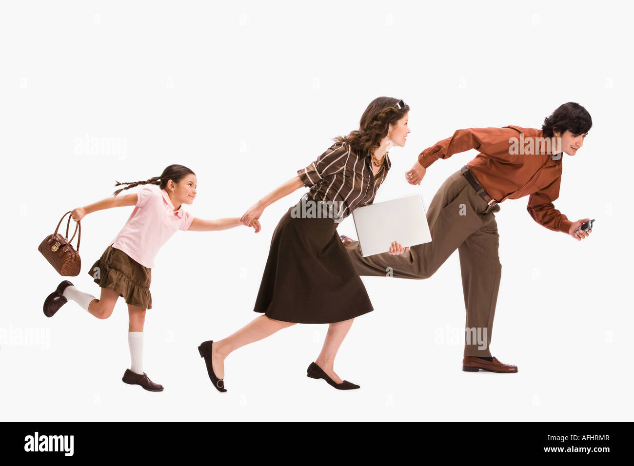 Studio portrait of family running Stock Photo - Alamy