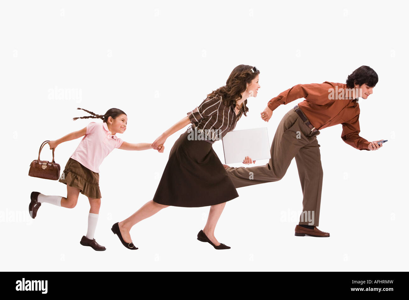 Studio portrait of family running Stock Photo - Alamy