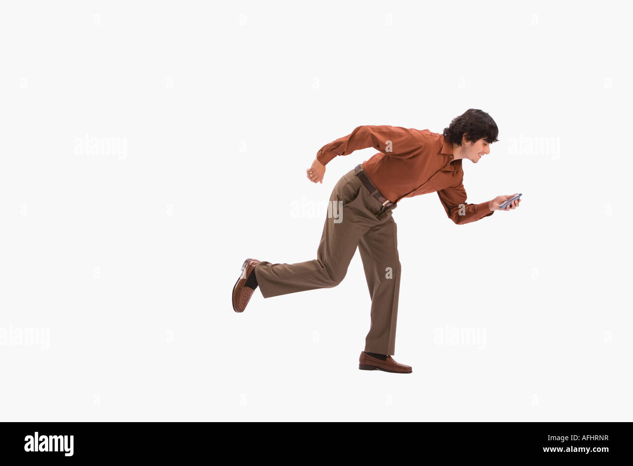 Studio portrait of man running Stock Photo - Alamy