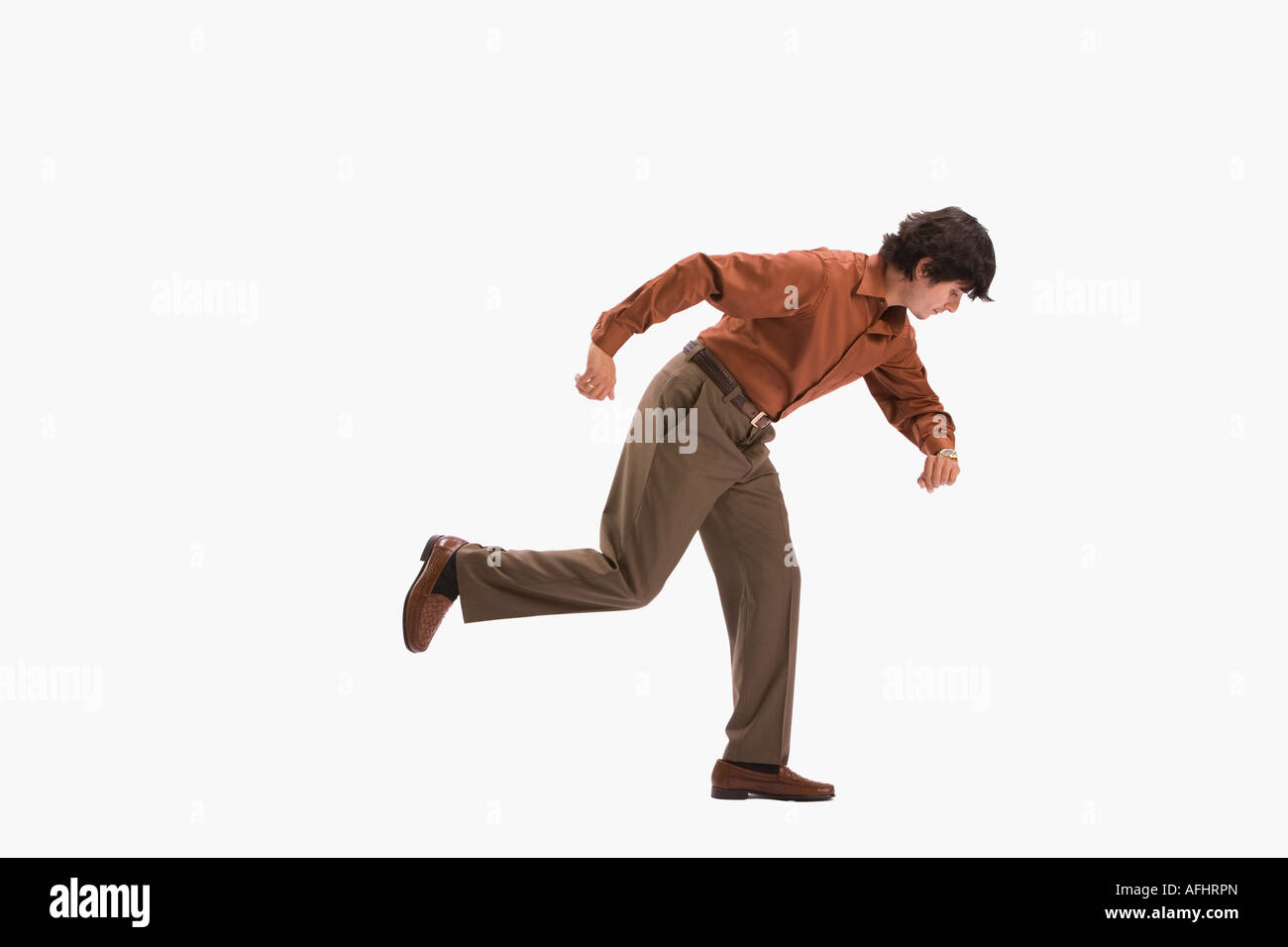 Studio portrait of man running Stock Photo - Alamy