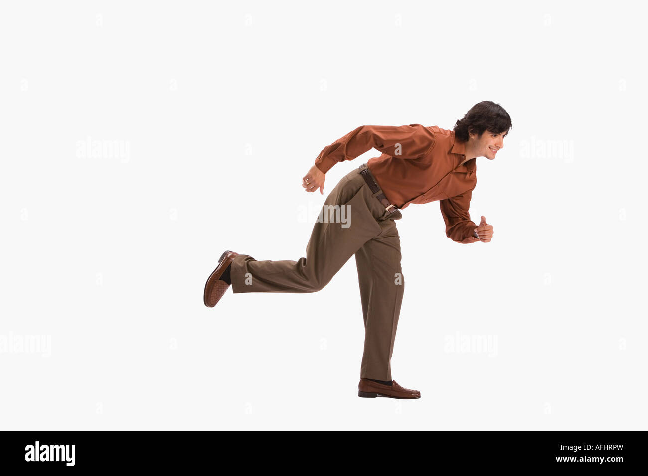 Studio portrait of man running Stock Photo - Alamy