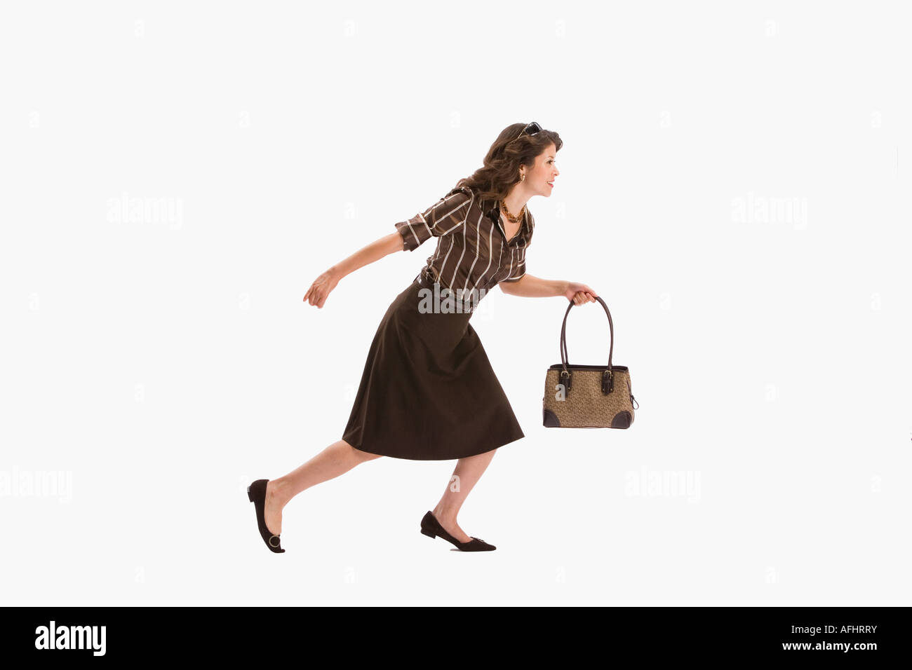 Studio portrait of woman running Stock Photo - Alamy