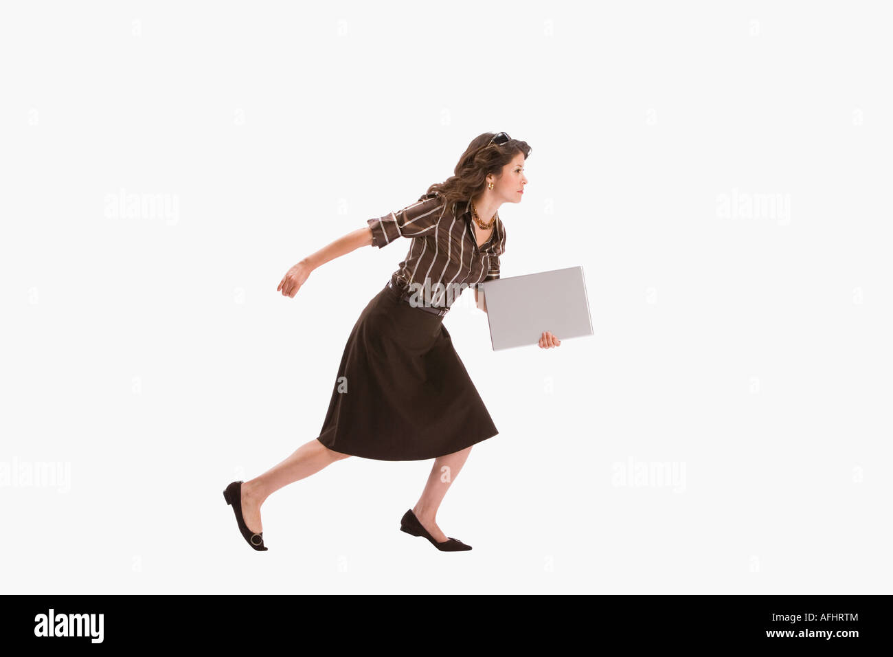 Studio portrait of woman running Stock Photo - Alamy