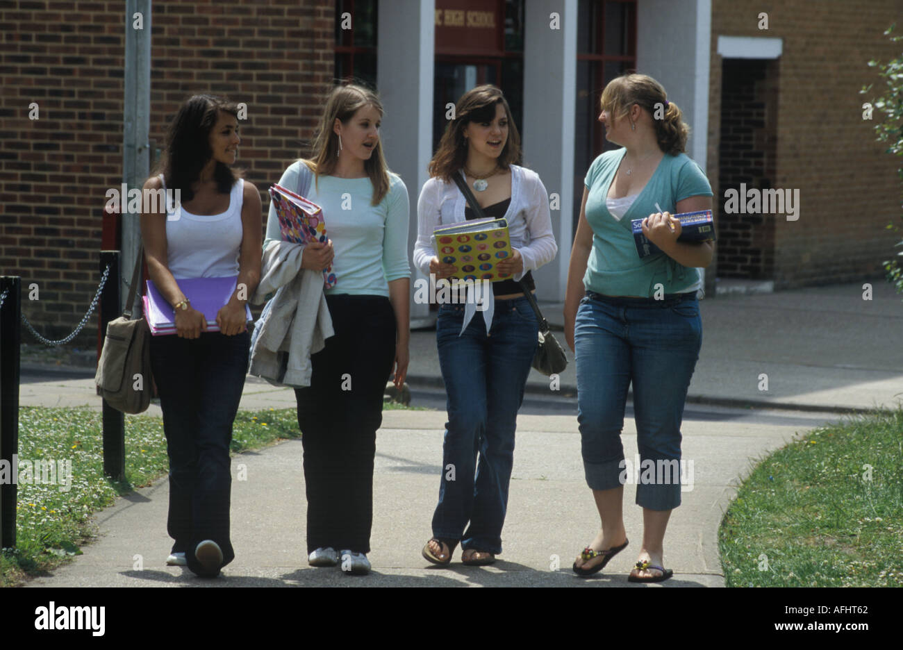 group of sixth form girls outside college building Stock Photo - Alamy