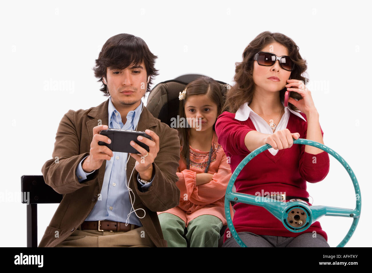 Distracted family in imaginary car Stock Photo - Alamy