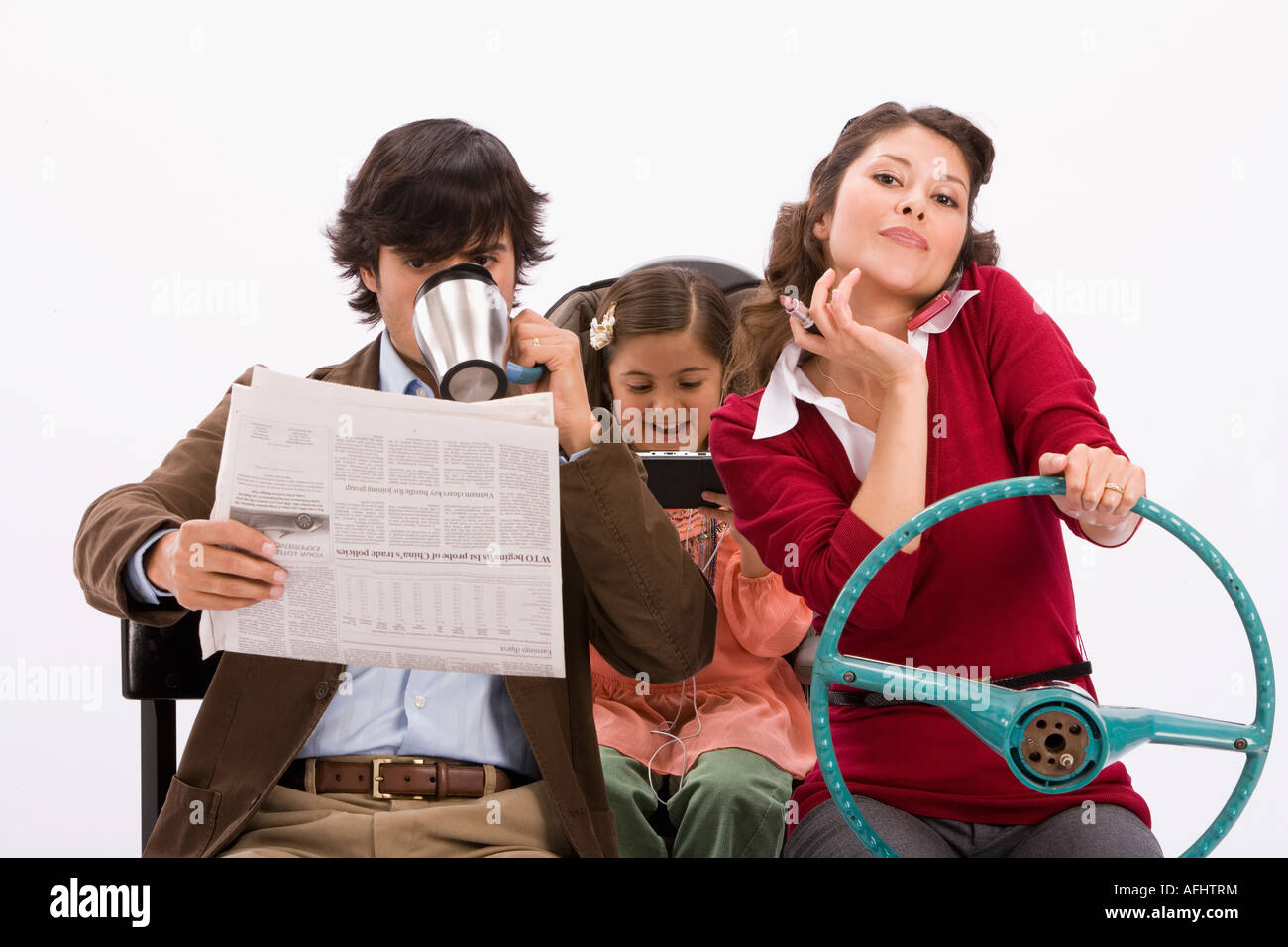 Distracted family in imaginary car Stock Photo - Alamy