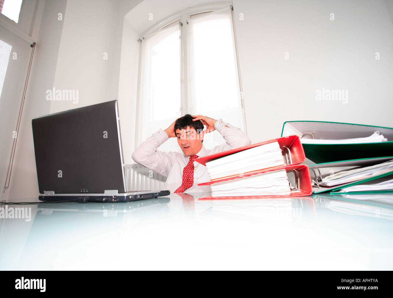 Troubled office worker Stock Photo - Alamy