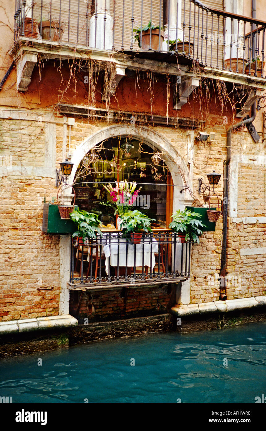 Canal side restaurant in Venice Italy Stock Photo - Alamy