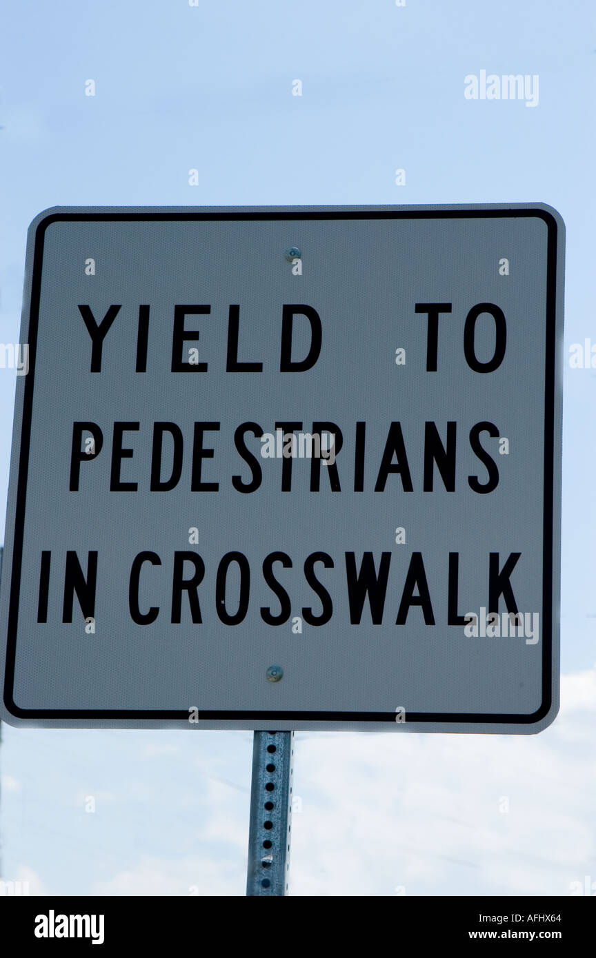YIELD TO PEDESTRIAN IN CROSSWALK traffic sign Stock Photo - Alamy