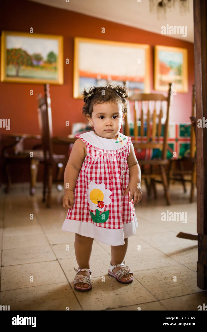 Portrait of a baby girl standing Stock Photo - Alamy