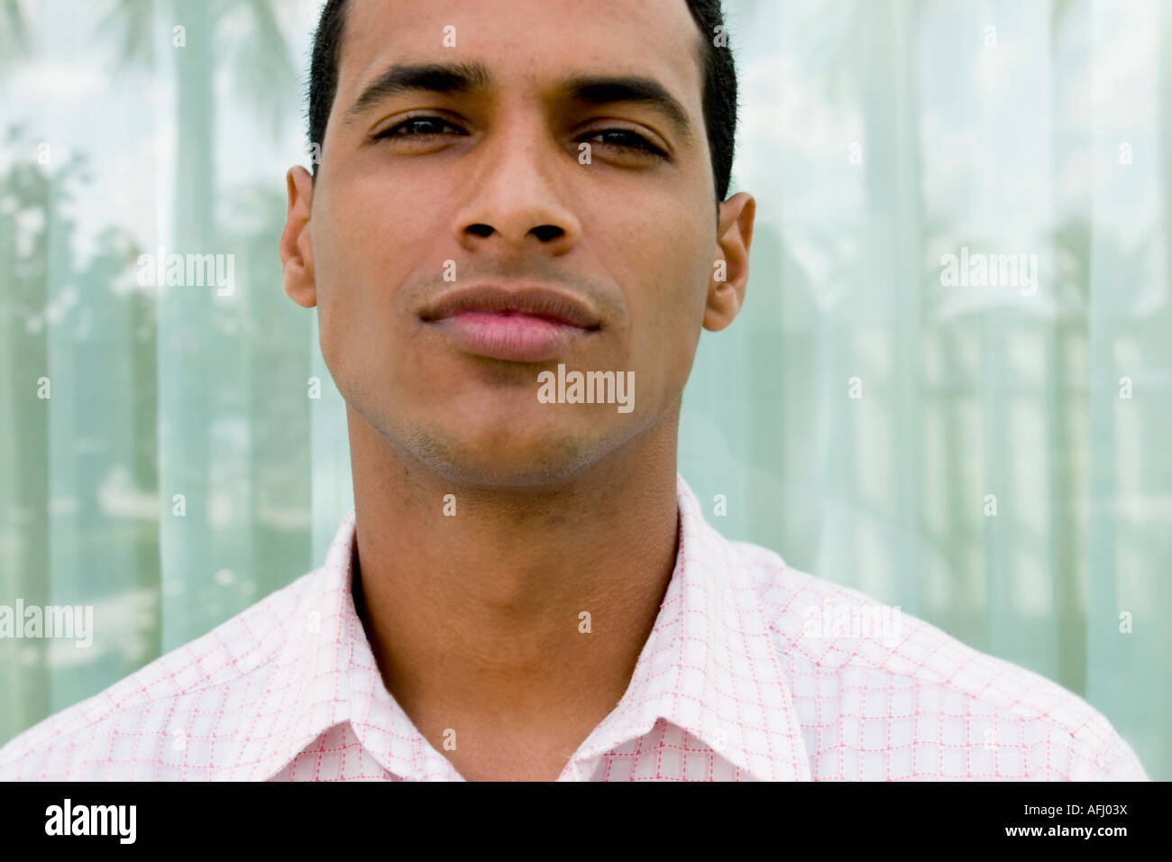 Young man looking serious Stock Photo - Alamy