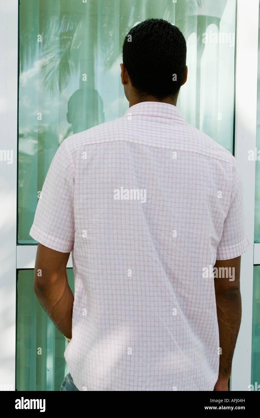Rear view of a young man Stock Photo - Alamy