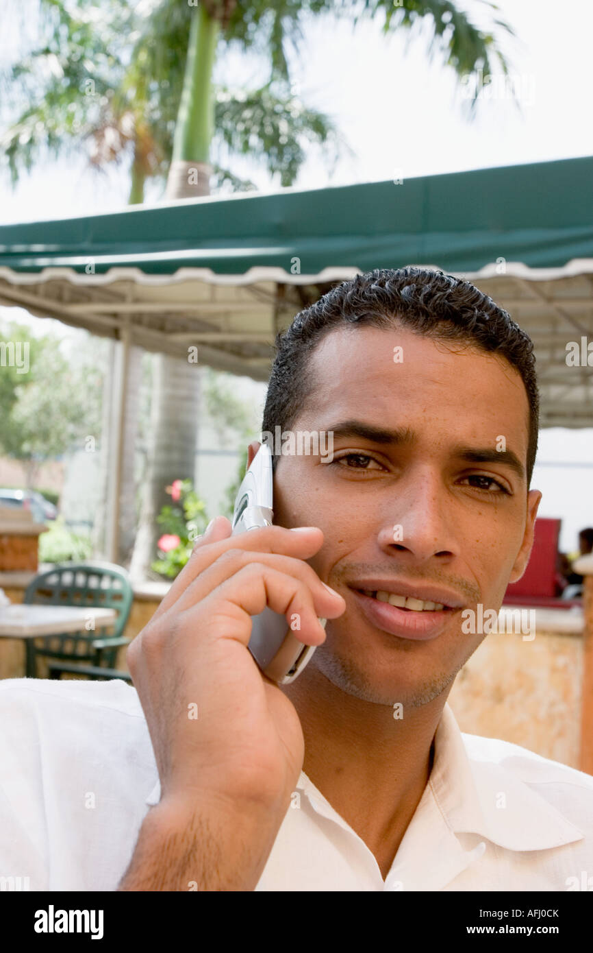Young man talking on a mobile phone Stock Photo - Alamy