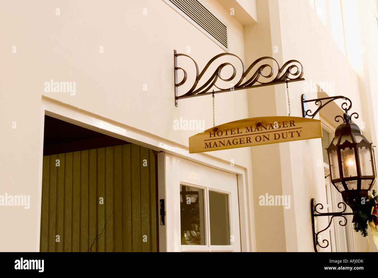 Sign board and a lantern in front of a building Stock Photo - Alamy