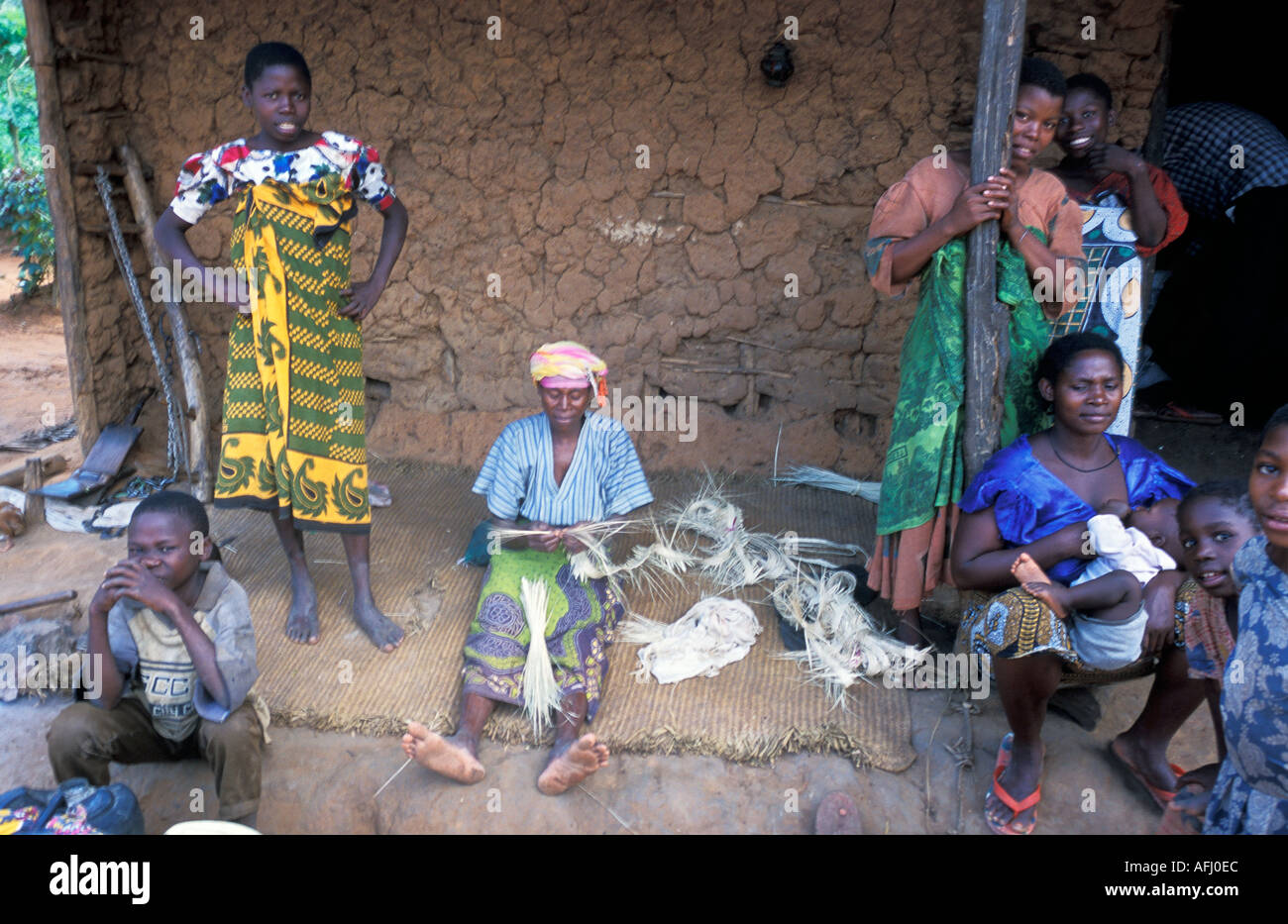 AFRICA KENYA KWALI Kenyan family on the porch of their rural home ...