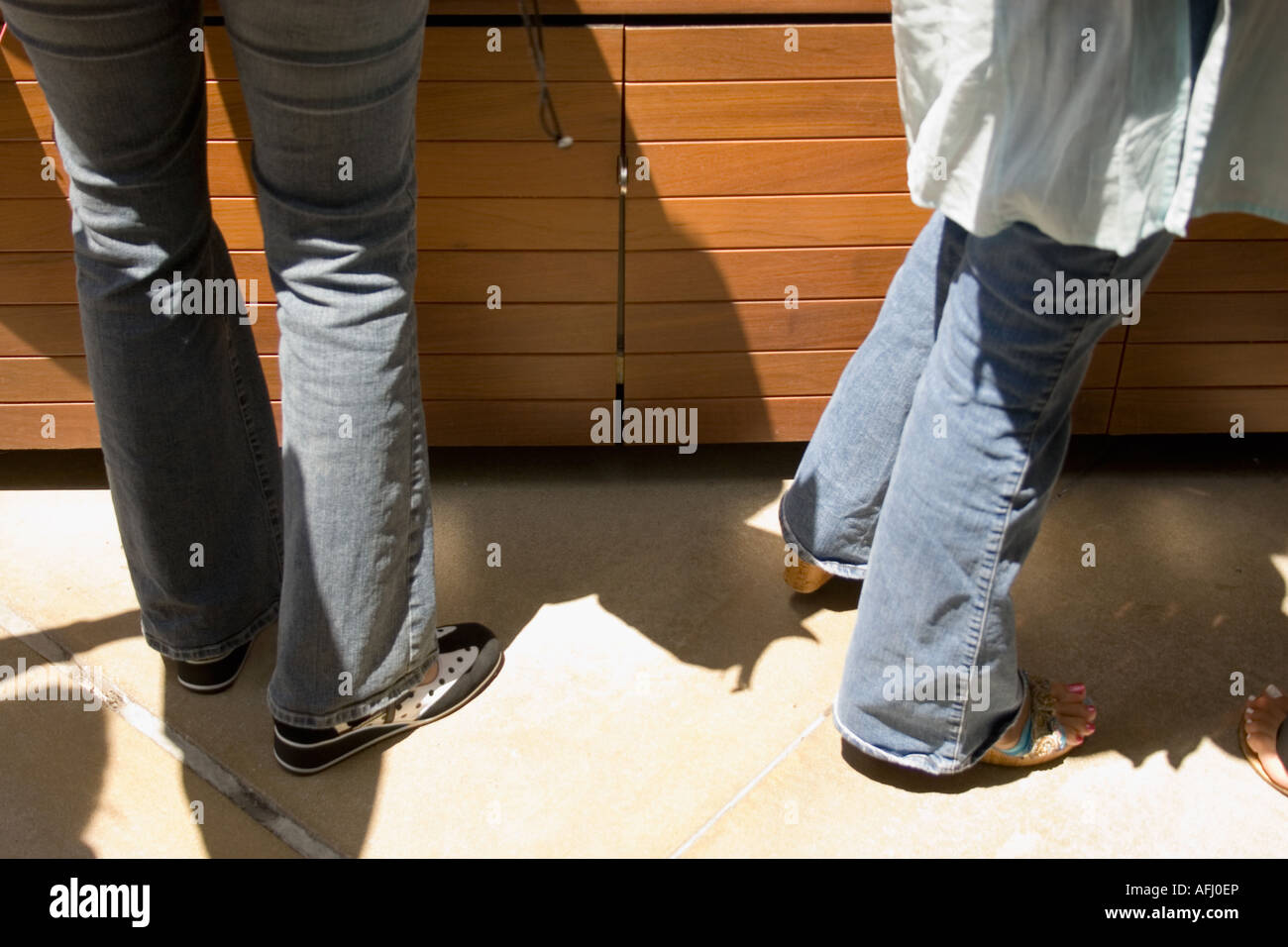 Low section view of two people standing Stock Photo - Alamy