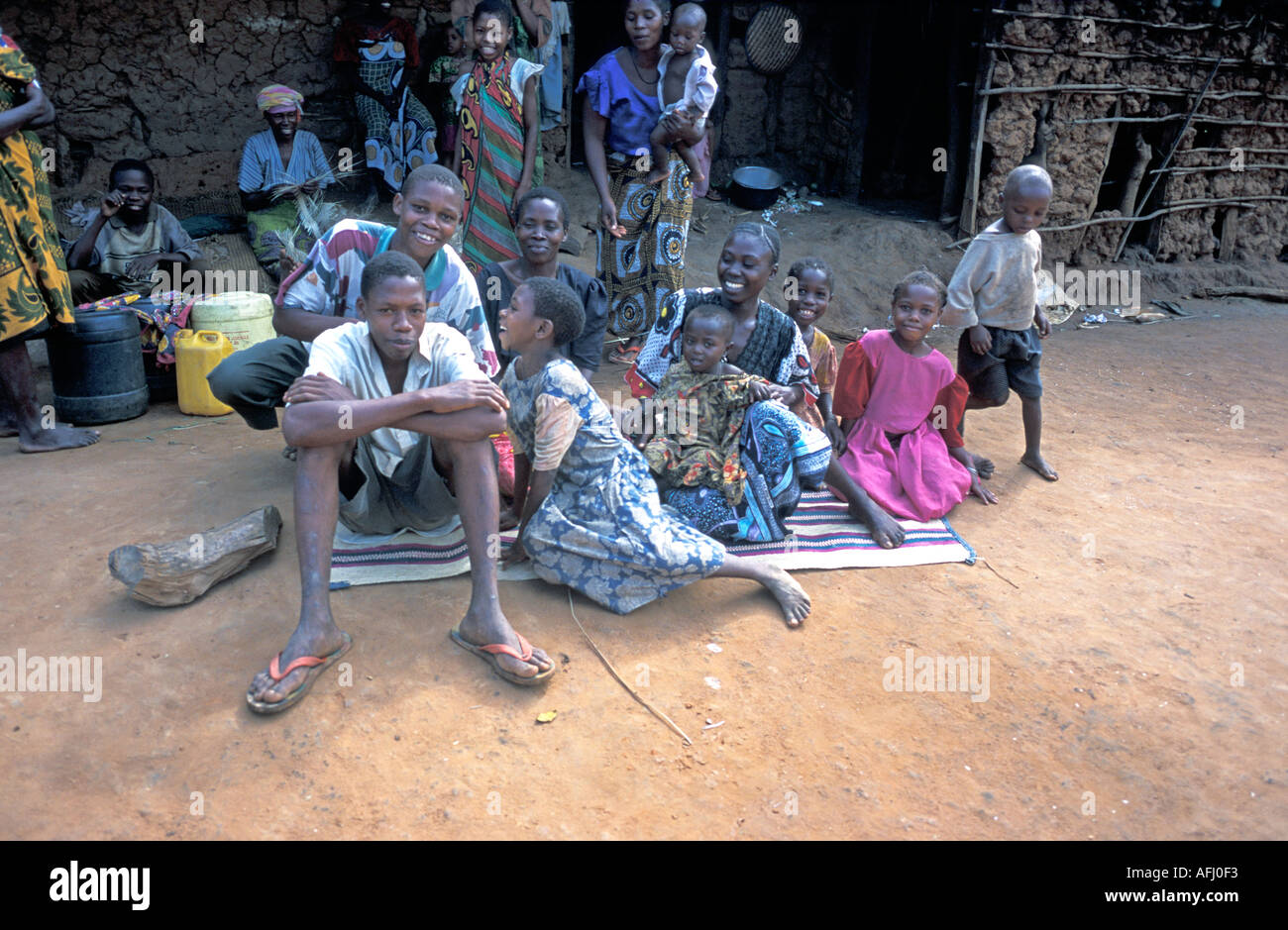 AFRICA KENYA KWALI Laughing Kenyan family poses in front of their rural ...