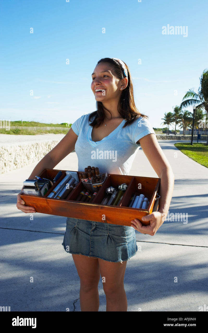 Woman selling cigars at beach Stock Photo - Alamy
