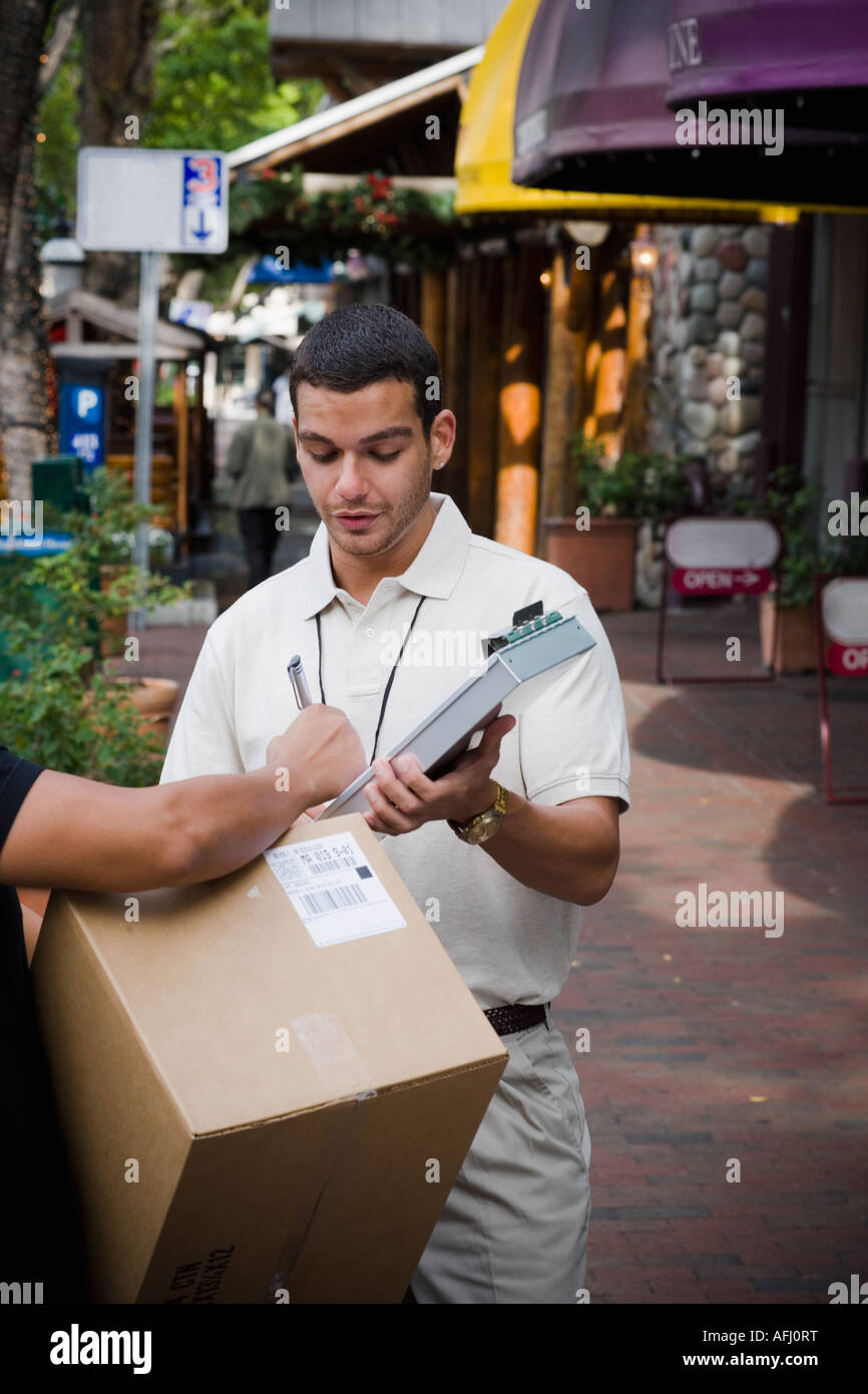 Delivery man making deliveries Stock Photo - Alamy