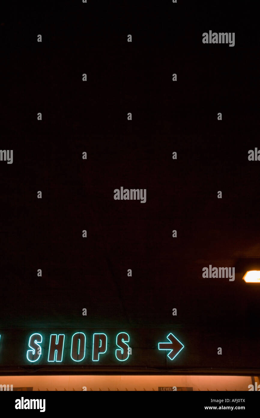 Neon Shops sign lit in shopping mall parking garage Stock Photo - Alamy