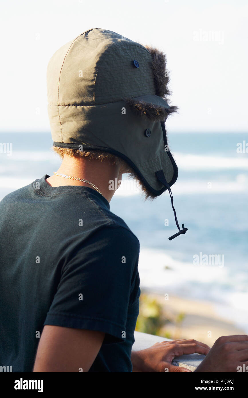Young man wearing hat, back view Stock Photo - Alamy