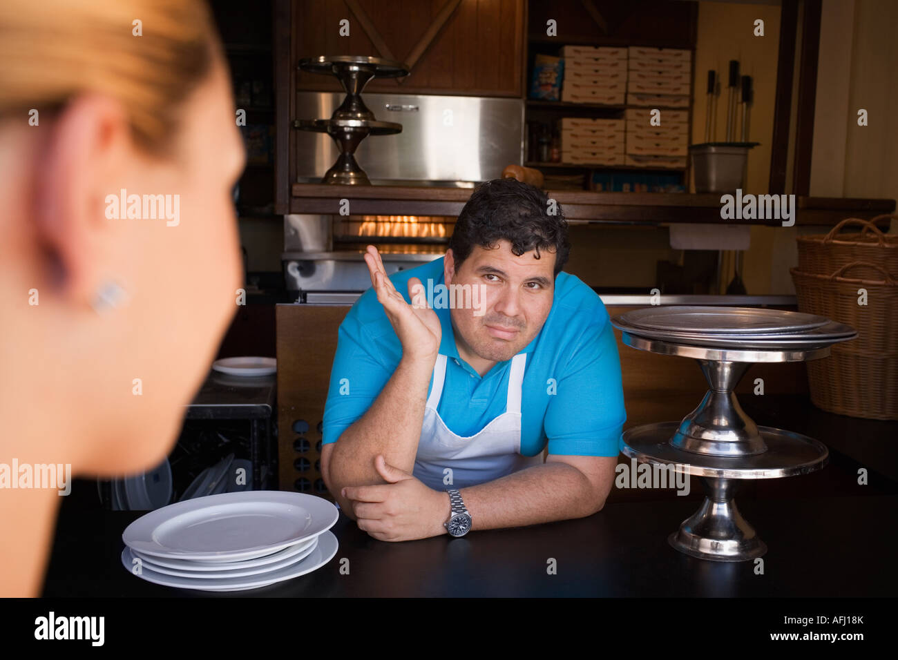 Chef interacting with customer Stock Photo - Alamy