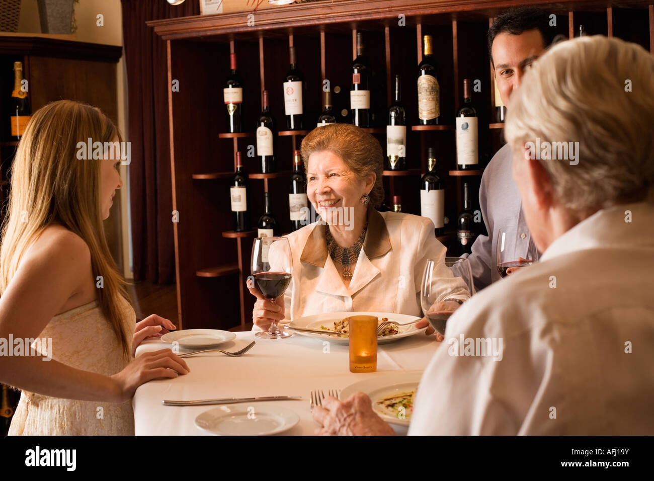 Family dining in restaurant Stock Photo - Alamy
