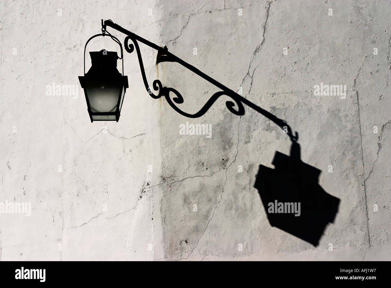 Hanging lamp casting shadow Stock Photo - Alamy