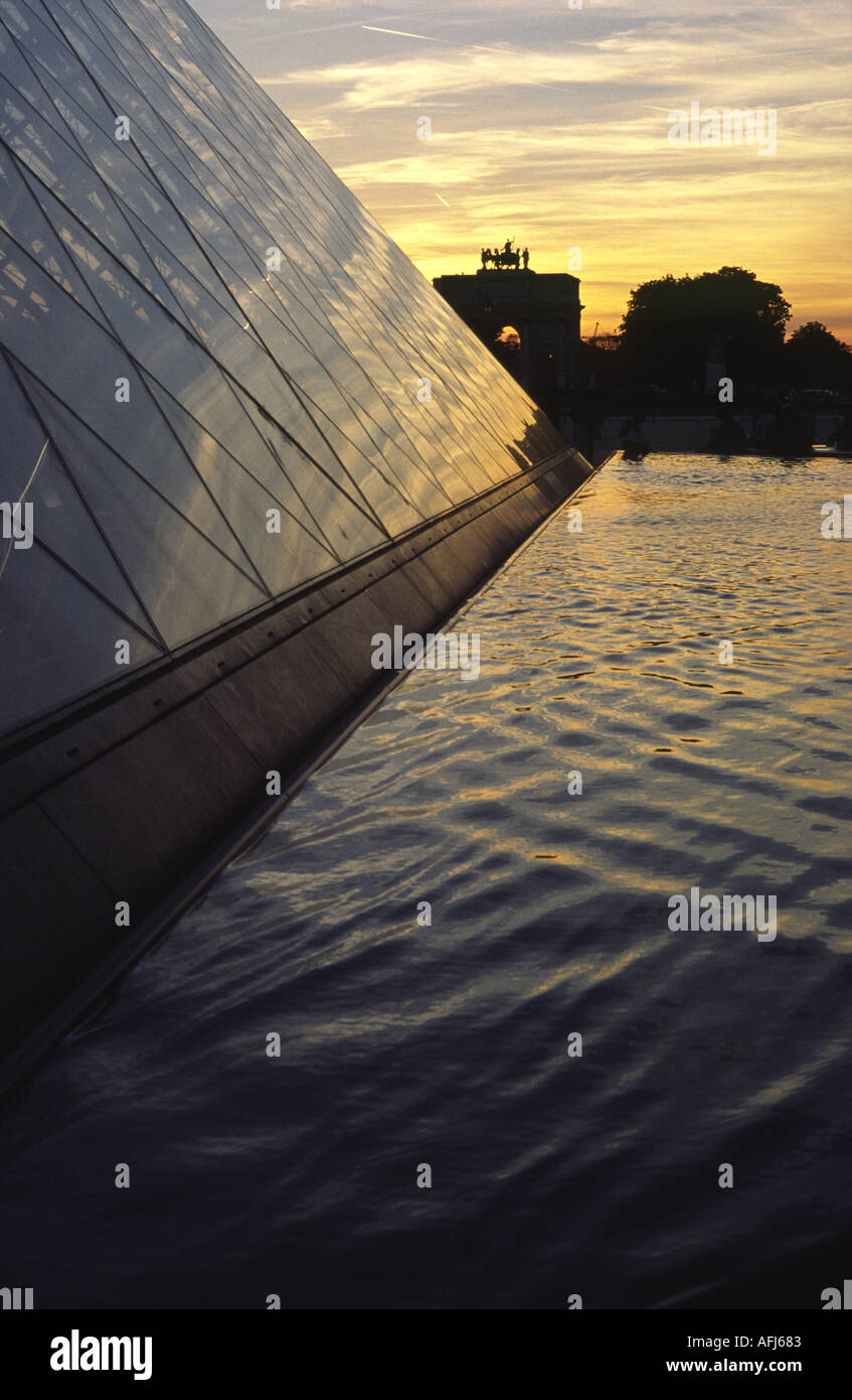 Sunset at the glass pyramid at the Louvre in Paris France Stock Photo ...