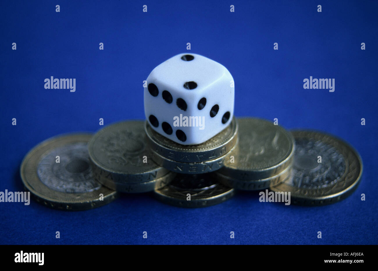 Dice and coins Stock Photo - Alamy