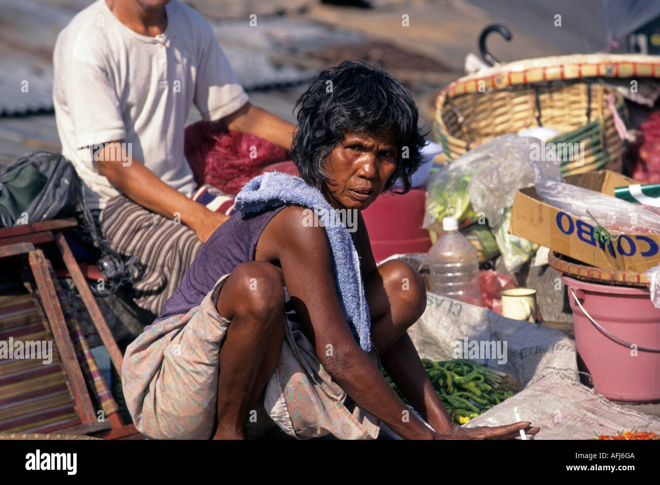 Man scavenging in street market Manila Philippines Stock Photo - Alamy
