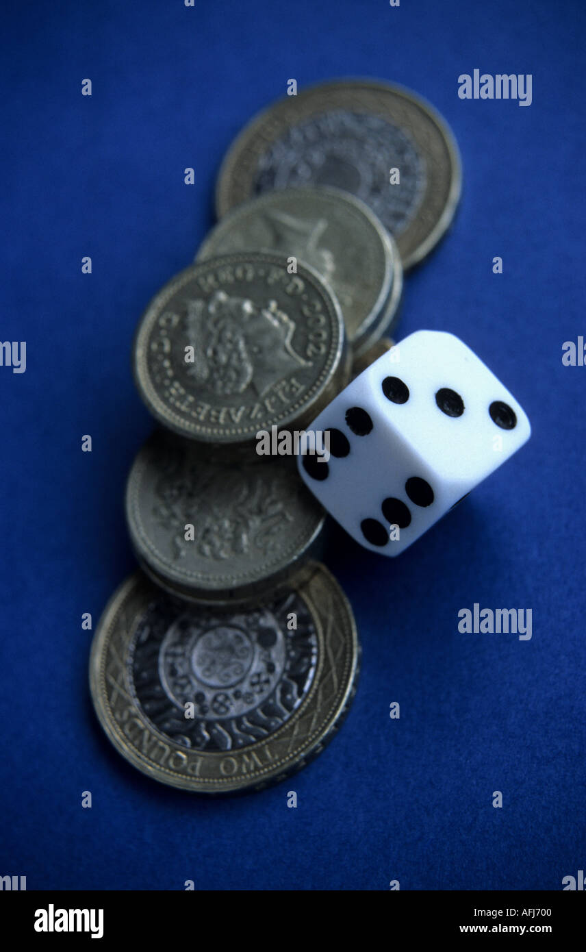 Dice and Coins Stock Photo - Alamy