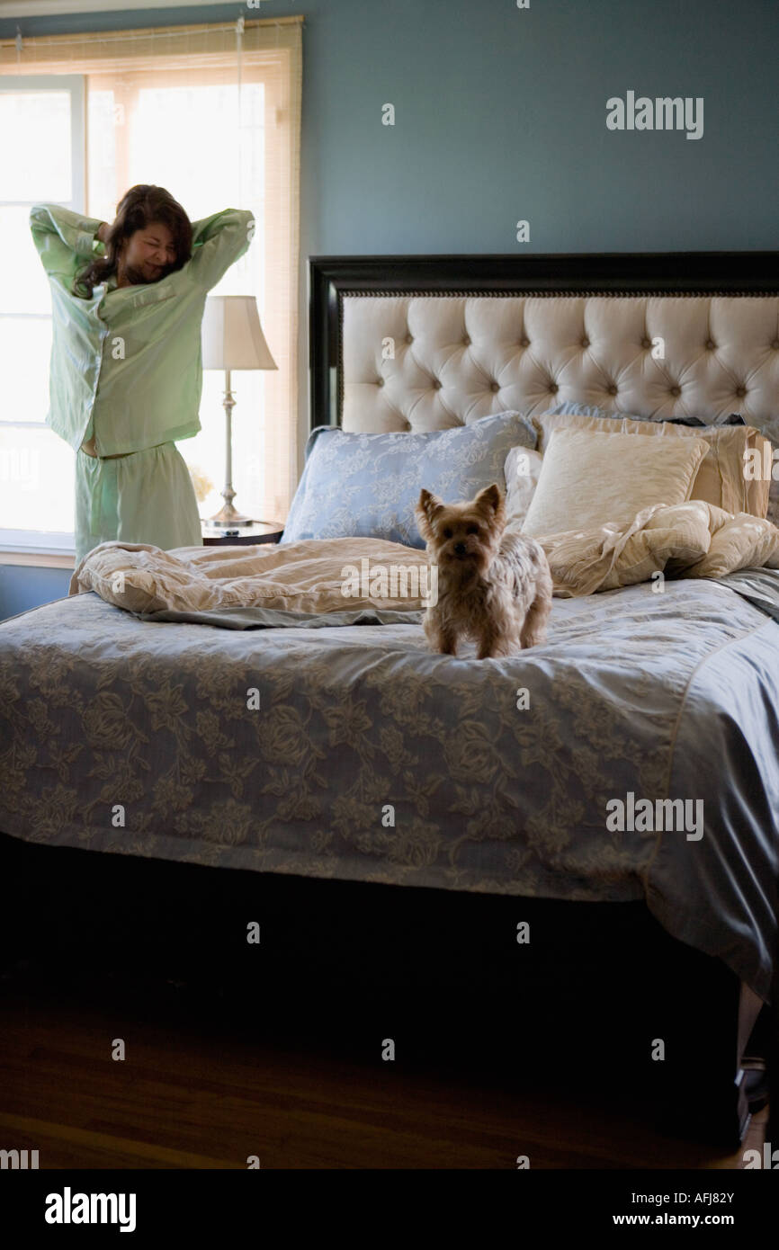 Young woman waking up Stock Photo - Alamy
