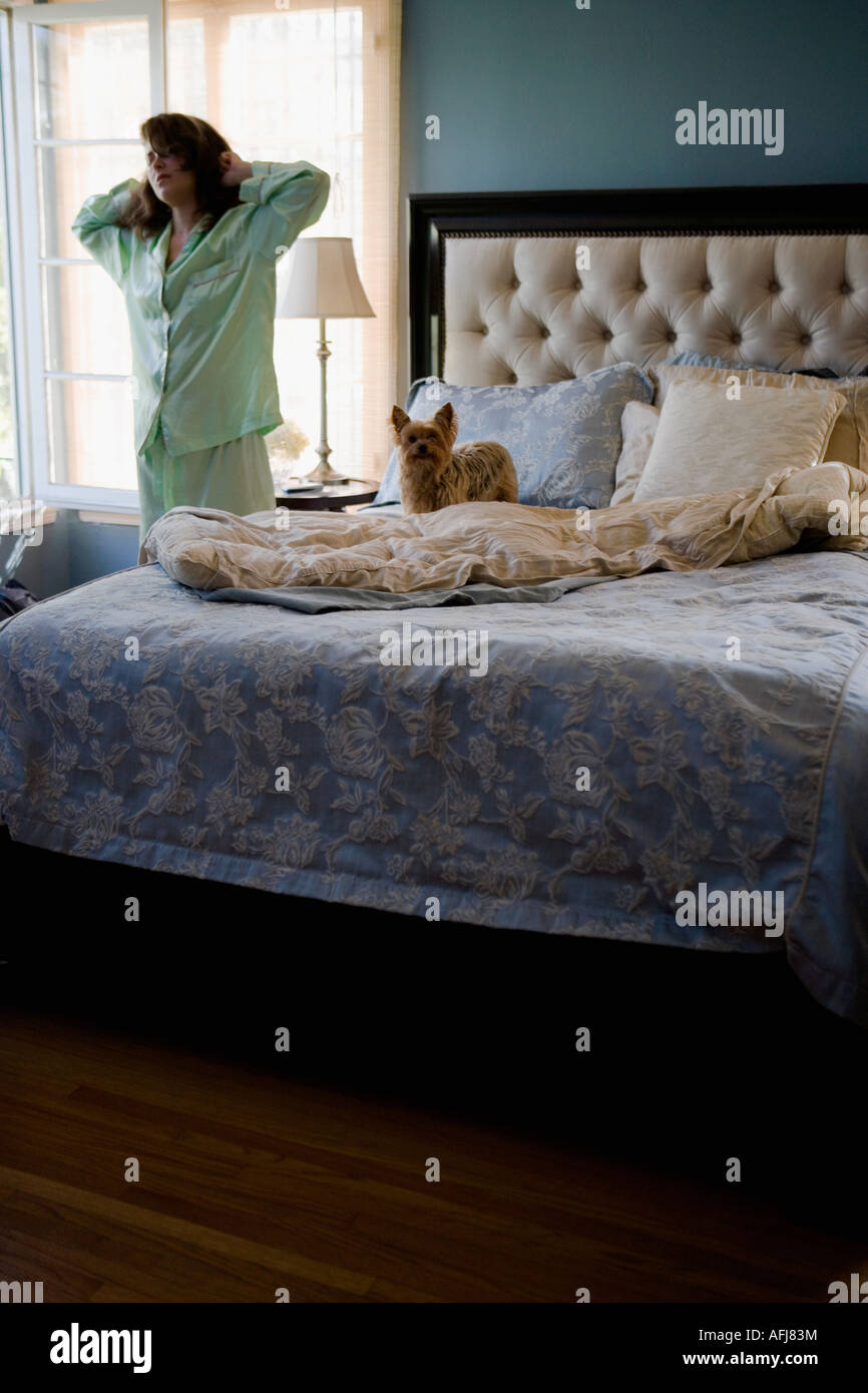 Young woman waking up Stock Photo - Alamy