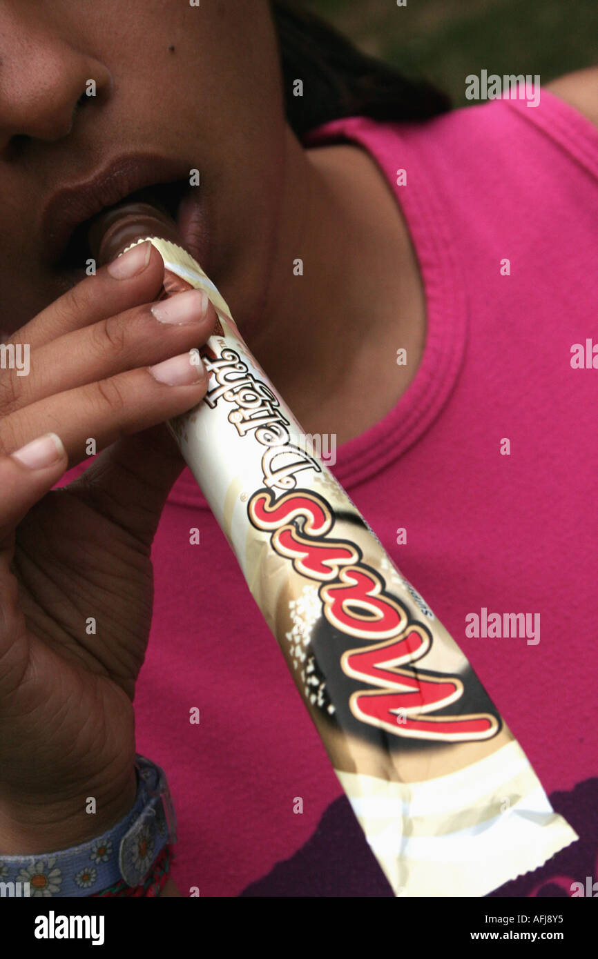 Women Eatinga Mars Delight Chocolate Stock Photo - Alamy