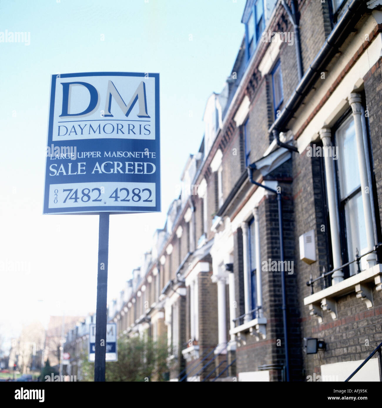 Estate Agents Sign Agreed sign board outside terraced houses Stock ...