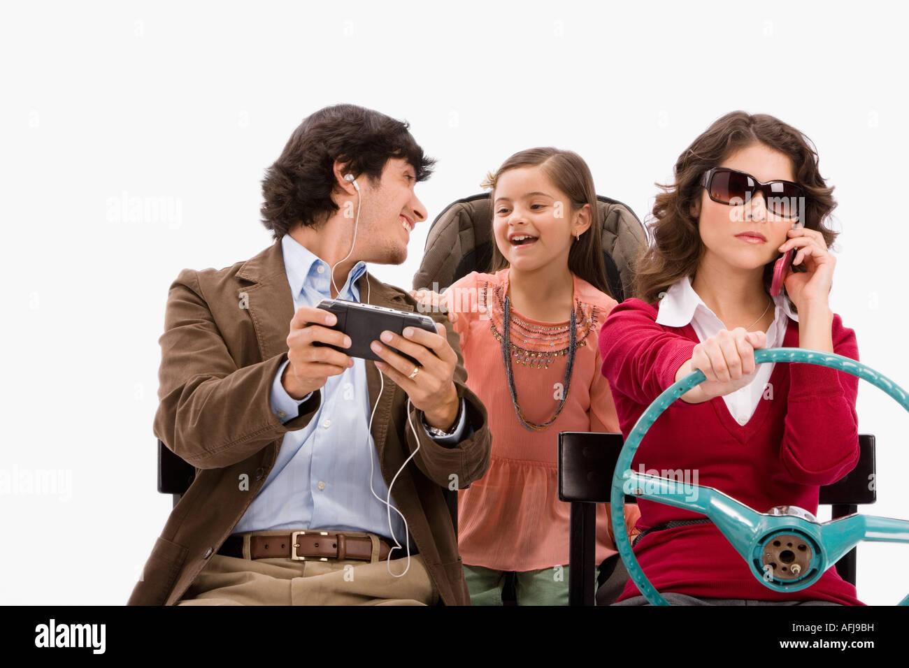 Distracted family in imaginary car Stock Photo - Alamy