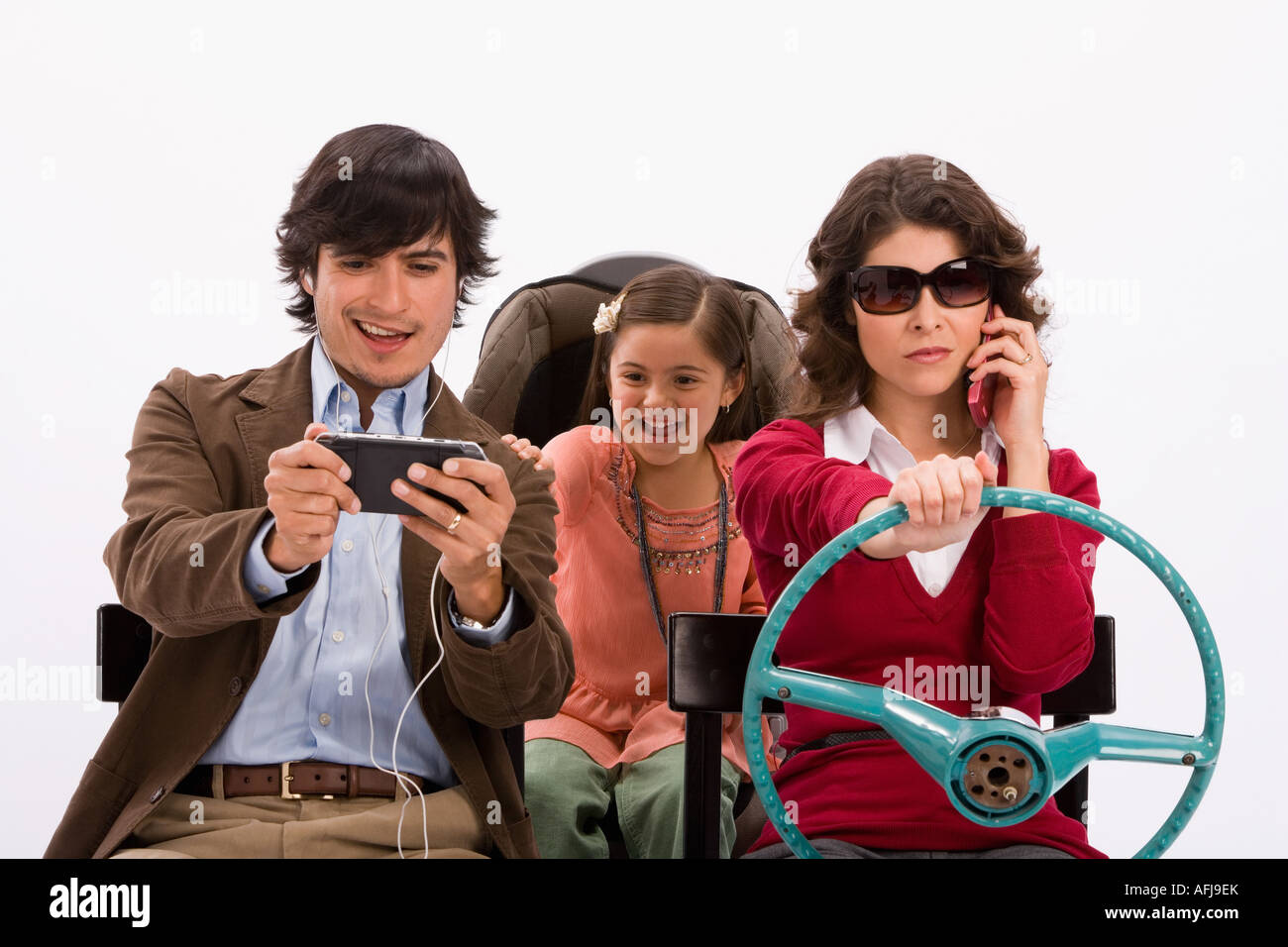 Distracted family in imaginary car Stock Photo - Alamy