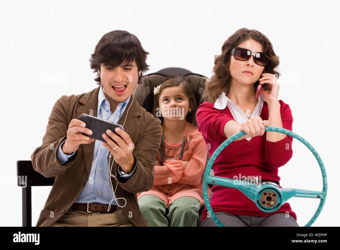 Distracted family in imaginary car Stock Photo - Alamy