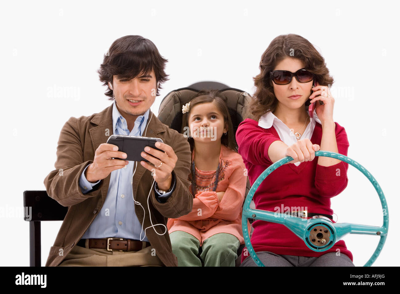 Distracted family in imaginary car Stock Photo - Alamy