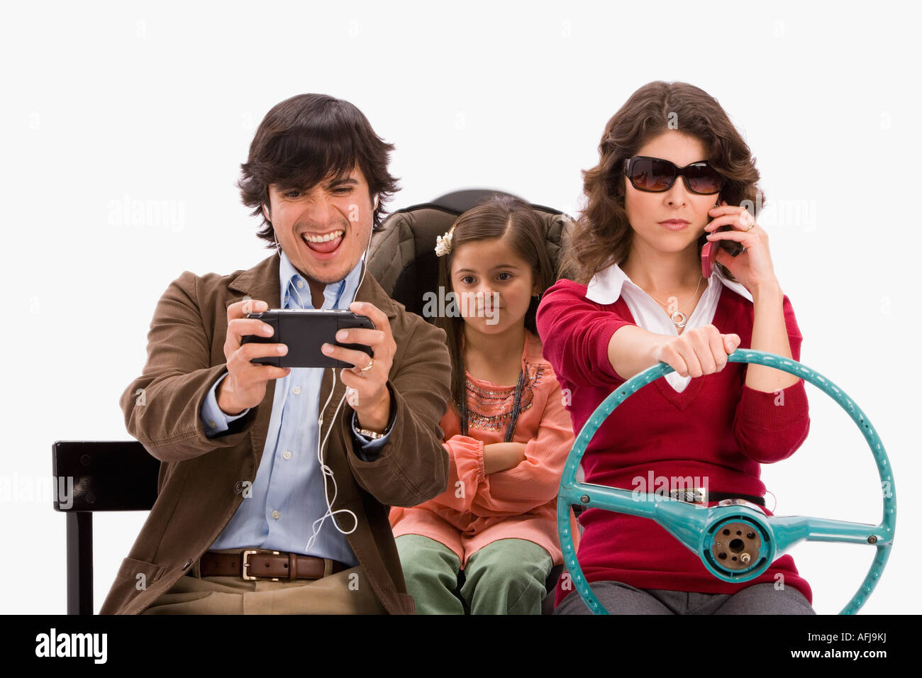Distracted family in imaginary car Stock Photo - Alamy