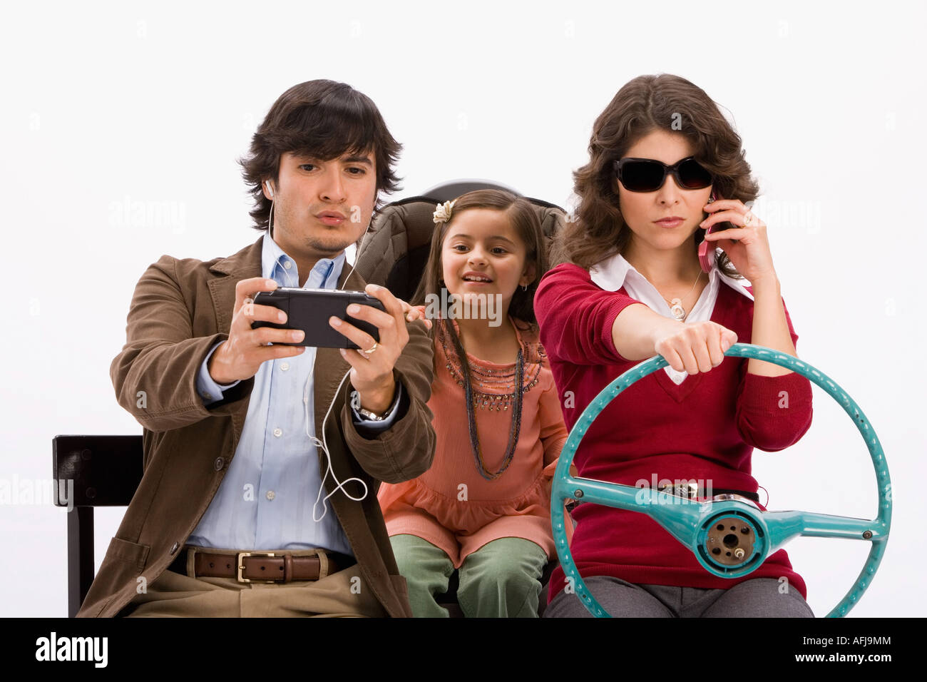Distracted family in imaginary car Stock Photo - Alamy