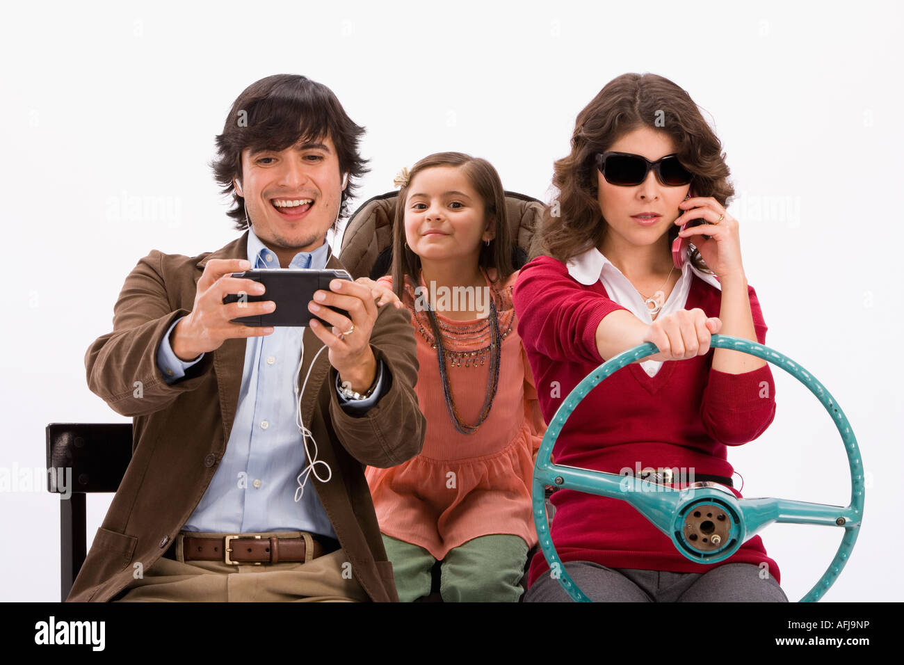 Distracted family in imaginary car Stock Photo - Alamy