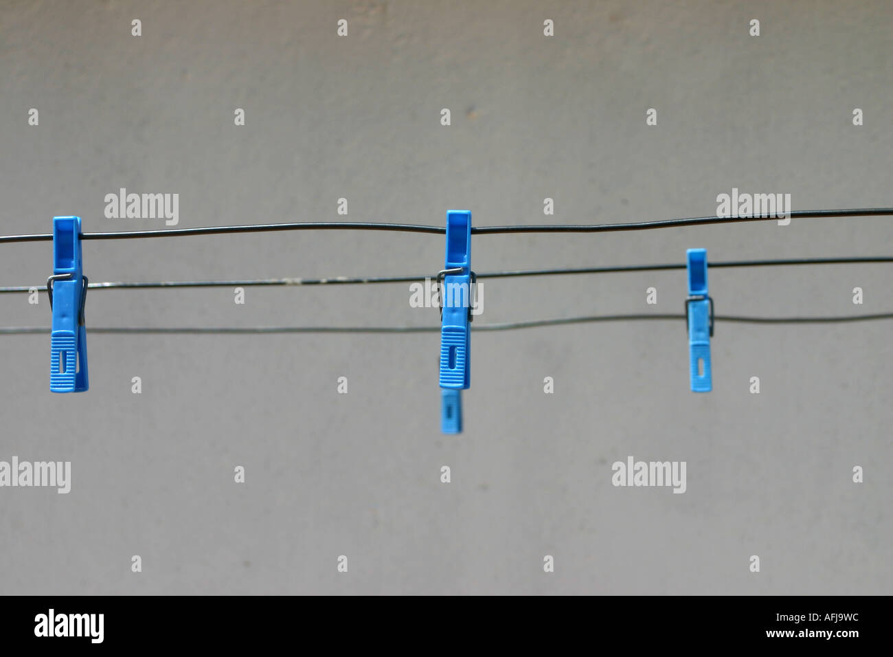 line of blue pegs Stock Photo - Alamy