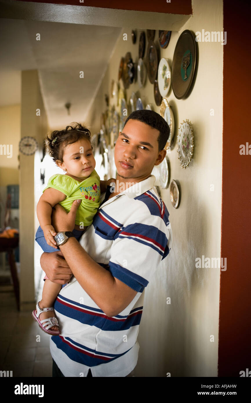 Young man carrying his sister Stock Photo - Alamy