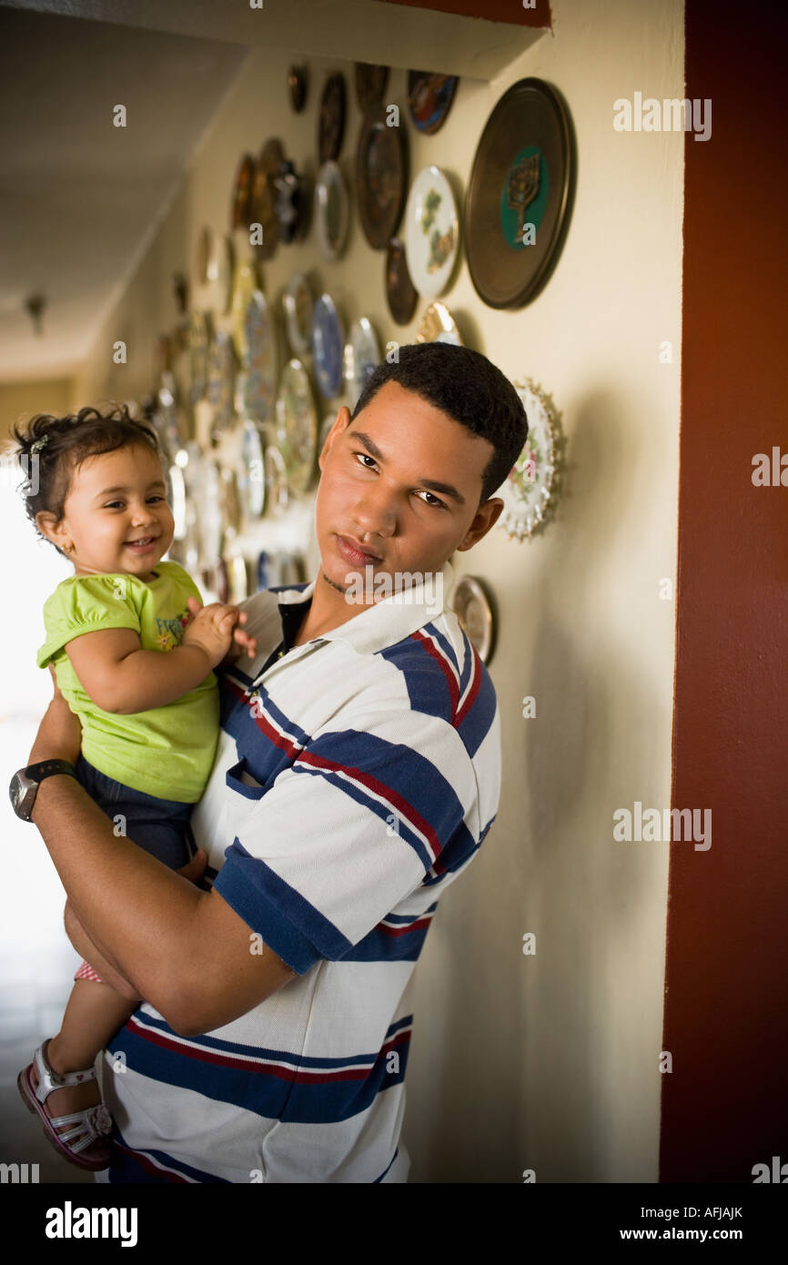 Young man carrying his sister Stock Photo - Alamy