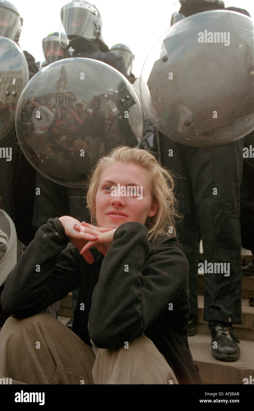 demonstrators sit in front of police line in Trafalgar Square Central ...