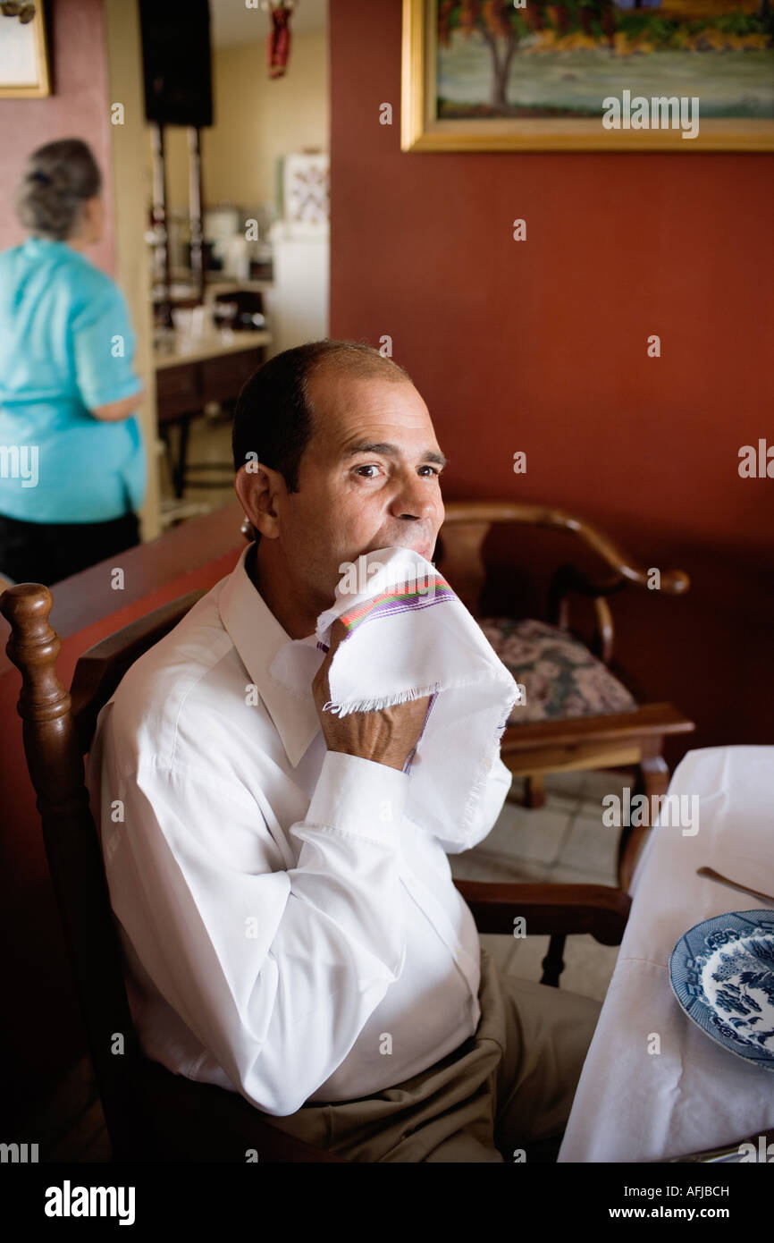 Mature man sitting at the dining table Stock Photo - Alamy